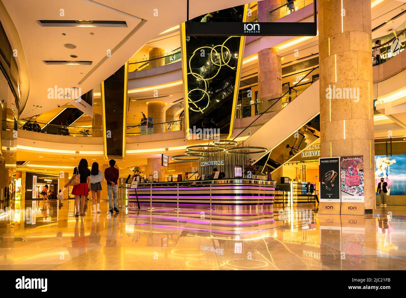 Concierge at the entrance of Ion Orchard Stock Photo - Alamy