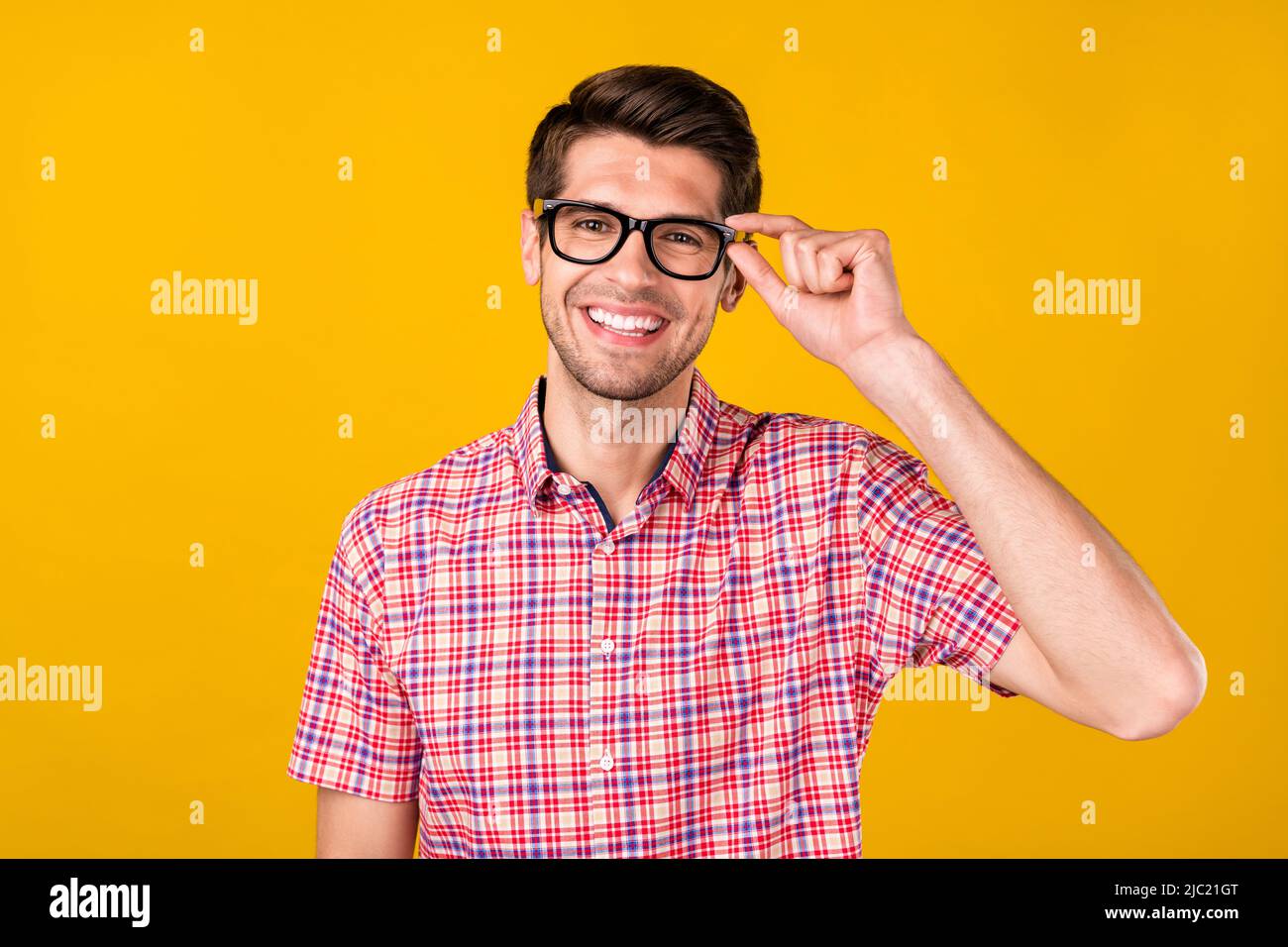 Portrait of attractive cheerful skilled guy geek it specialist wearing ...