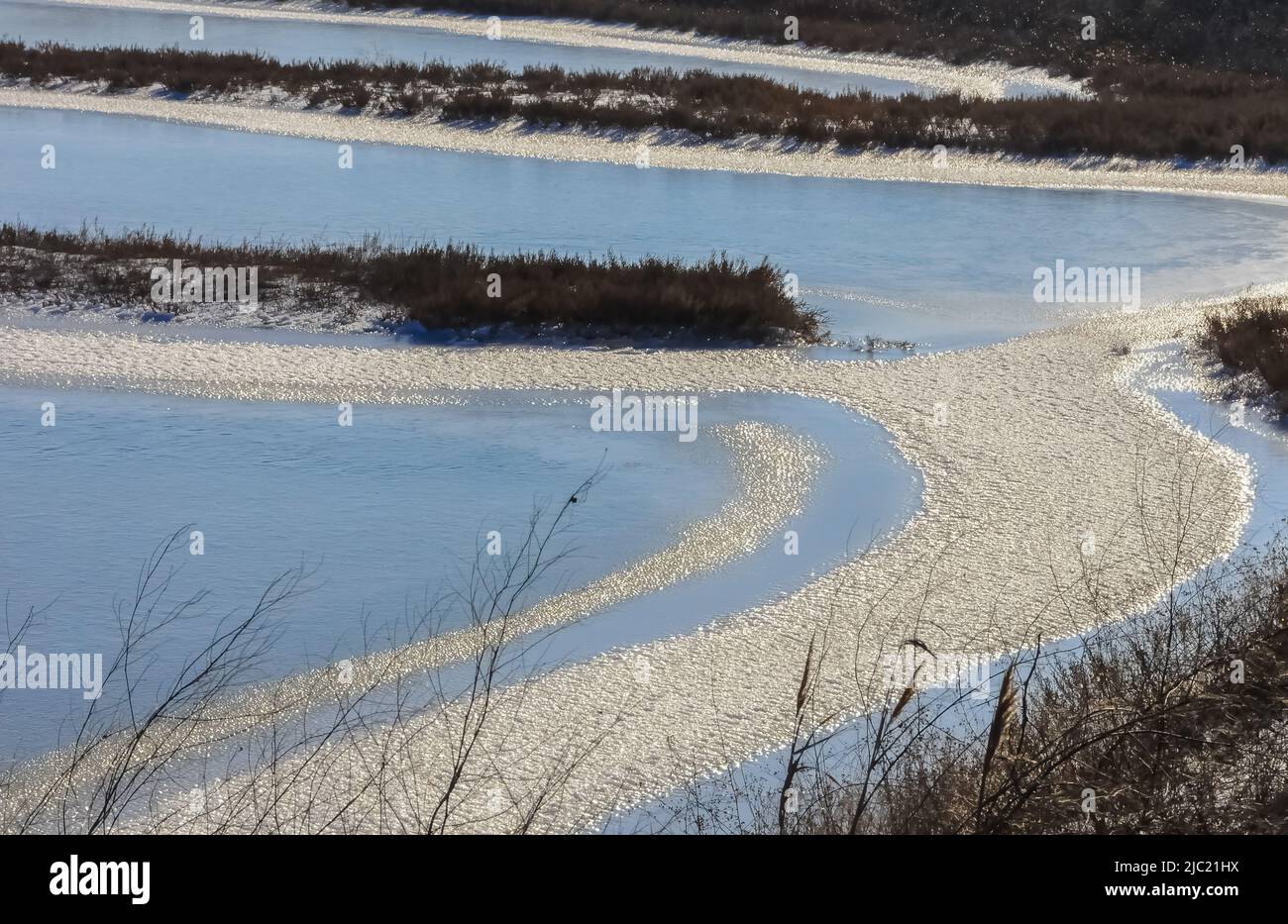 Frozen water, patterns of snow in small lakes. Tiligul estuary, Ukraine ...