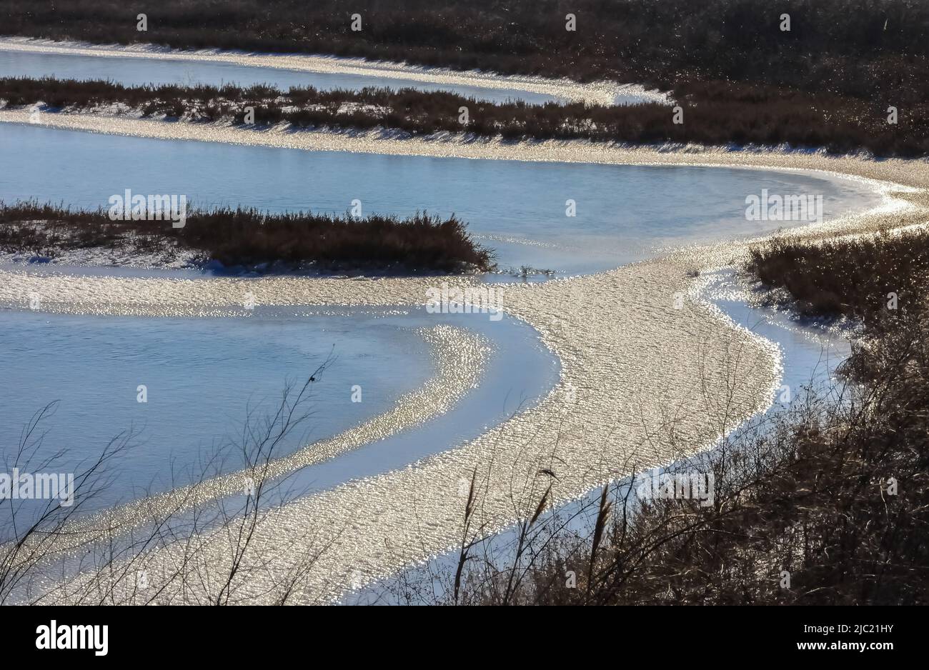 Frozen water, patterns of snow in small lakes. Tiligul estuary, Ukraine ...