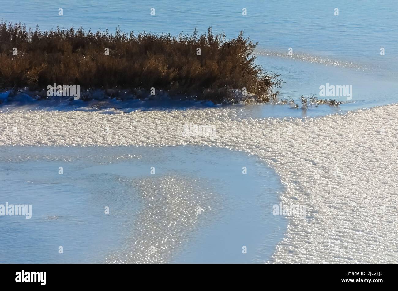 Frozen water, patterns of snow in small lakes. Tiligul estuary, Ukraine ...