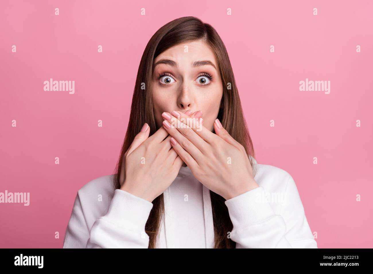 Photo of young woman close cover mouth hands oops fail worried nervous ...