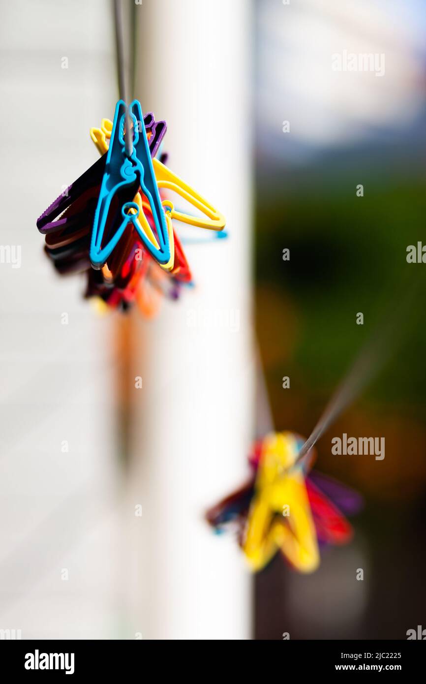 Colorful pegs on a washing line Stock Photo - Alamy