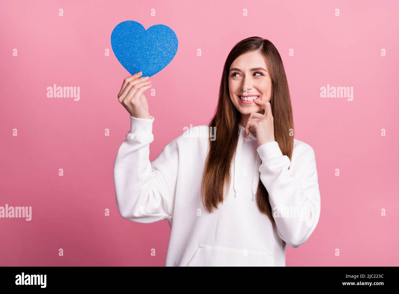 Photo of young girl happy positive smile think dream hold paper heart ...