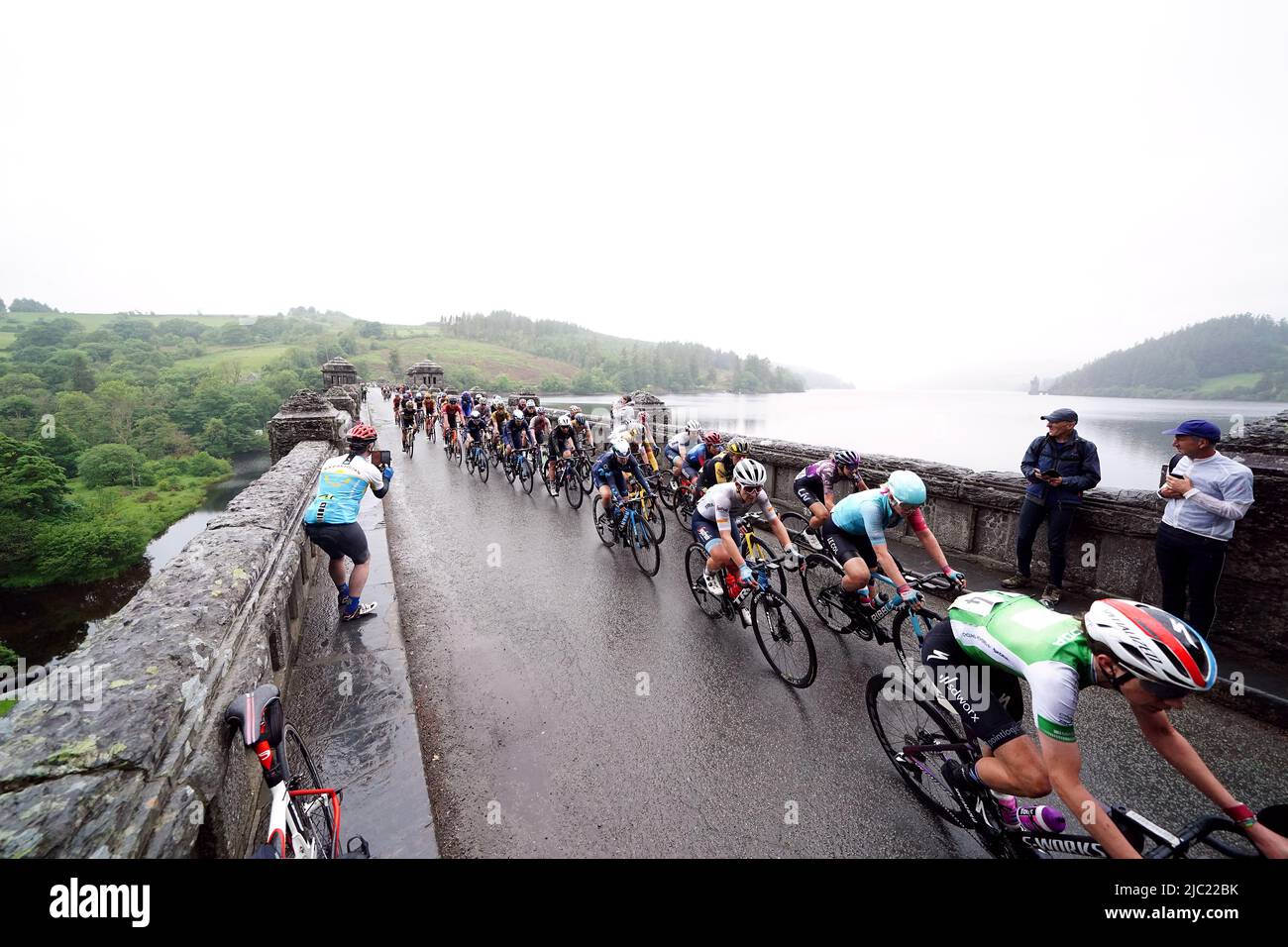 The peloton passes Lake Vyrnwy during stage four of The Women's Tour ...