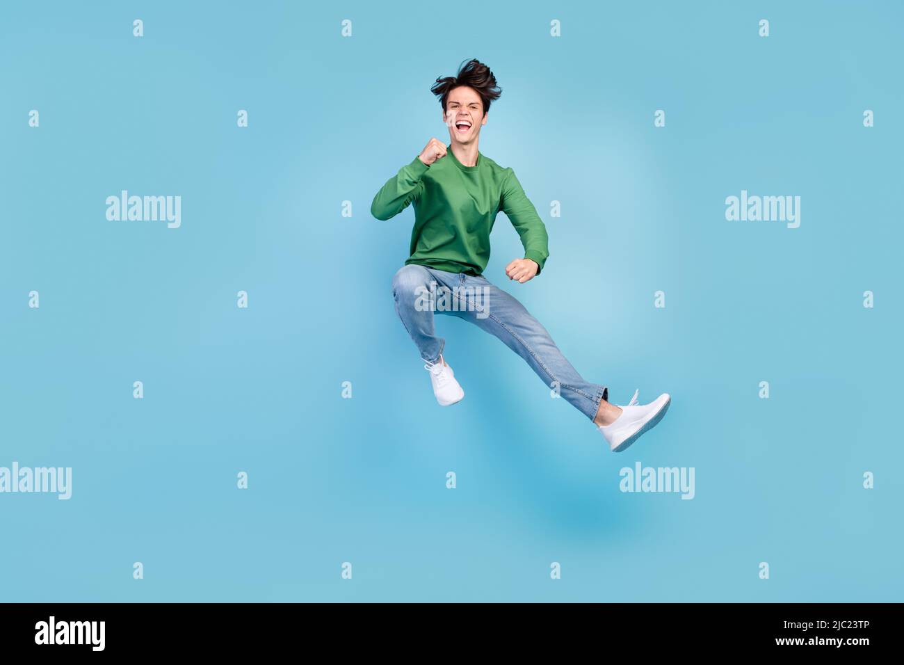 Full length body size photo guy jumping high gesturing like winner ...