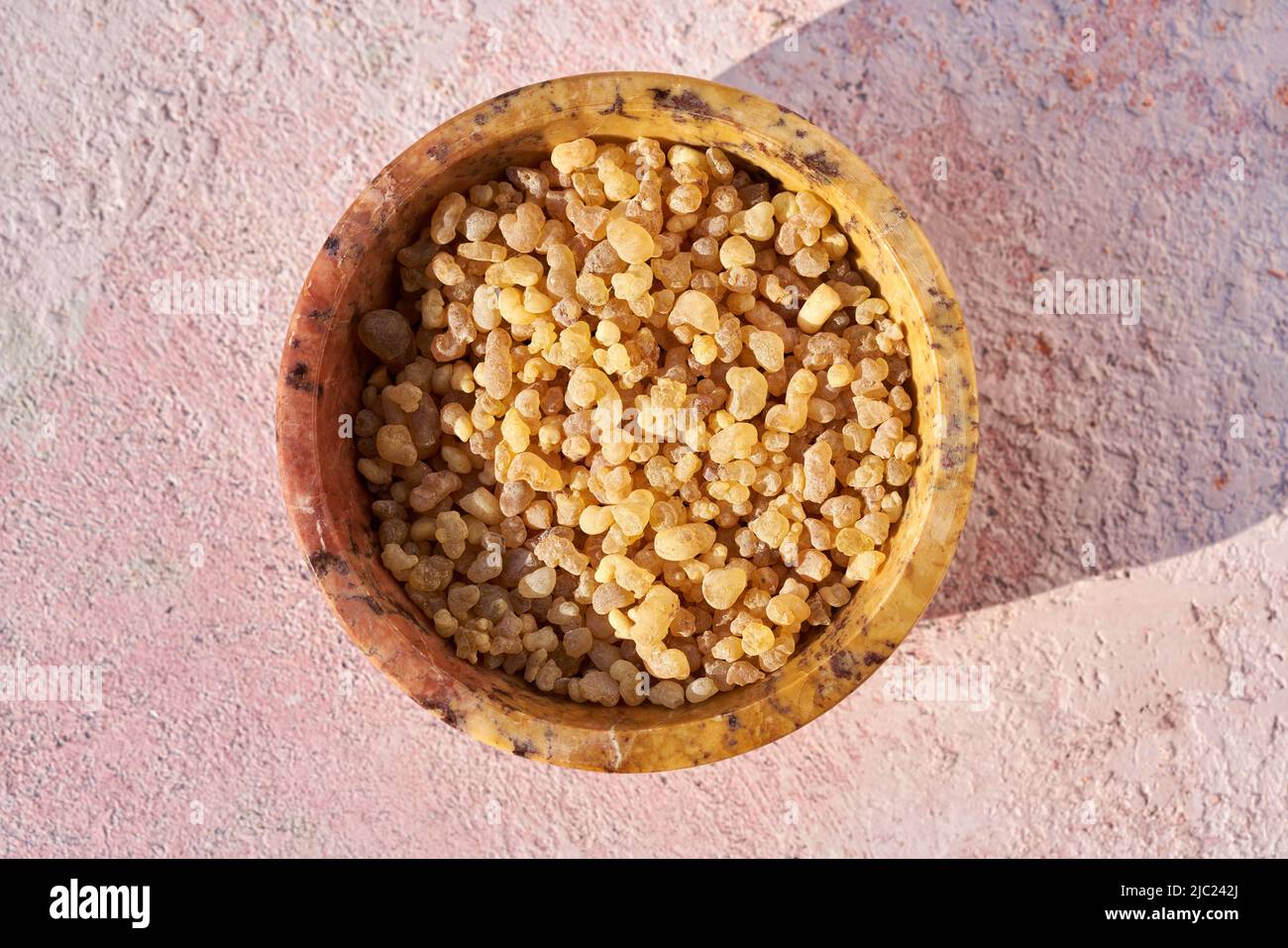 Frankincense resin crystals in a bowl, top view Stock Photo - Alamy