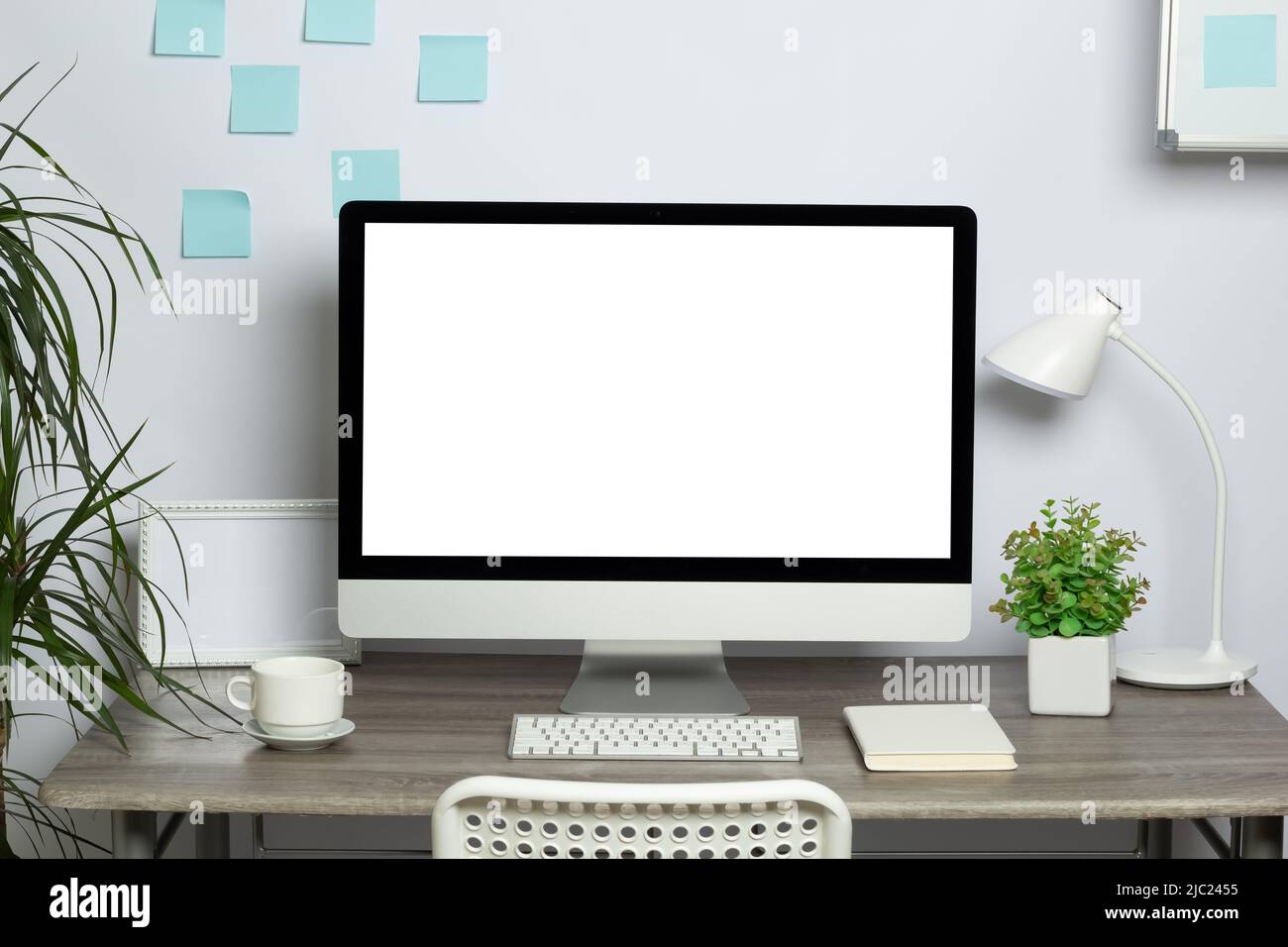 Modern computer with white screen and keyboard on stylish designer ...