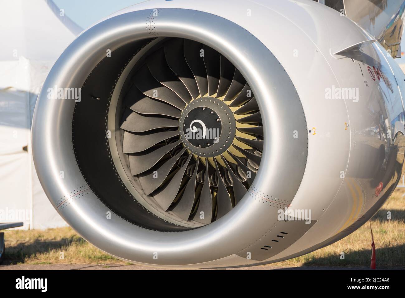 Commercial aircraft engine under the wing in a parking lot Stock Photo ...