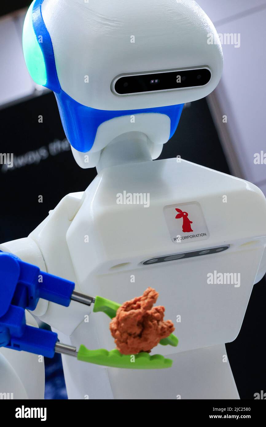 Tokyo, Japan. 9th June, 2022. A robot prepares a Japanese packed meal ...