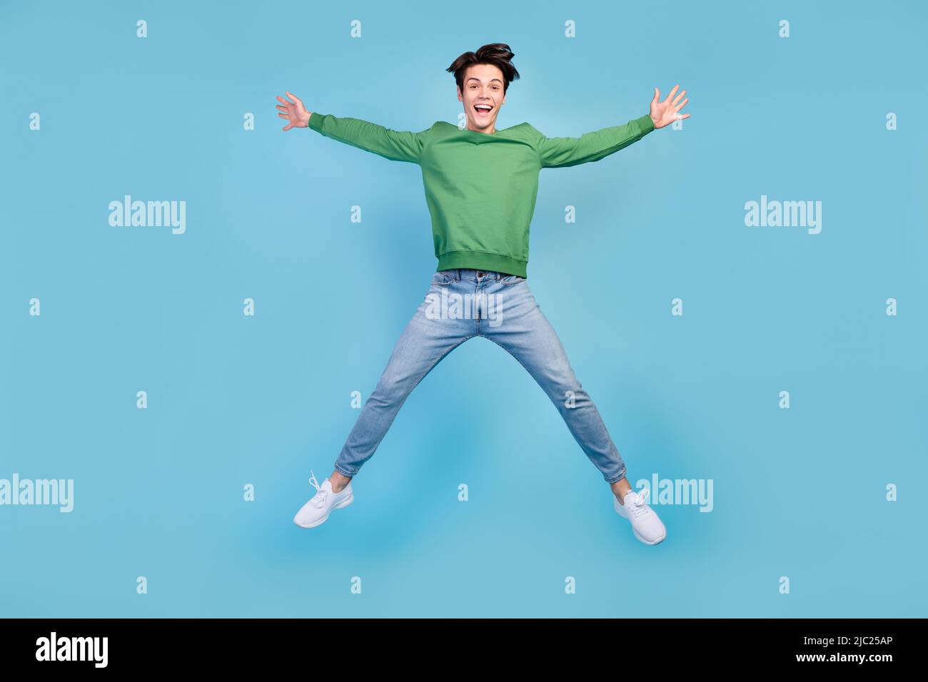 Full length body size photo guy smiling jumping up careless laughing ...