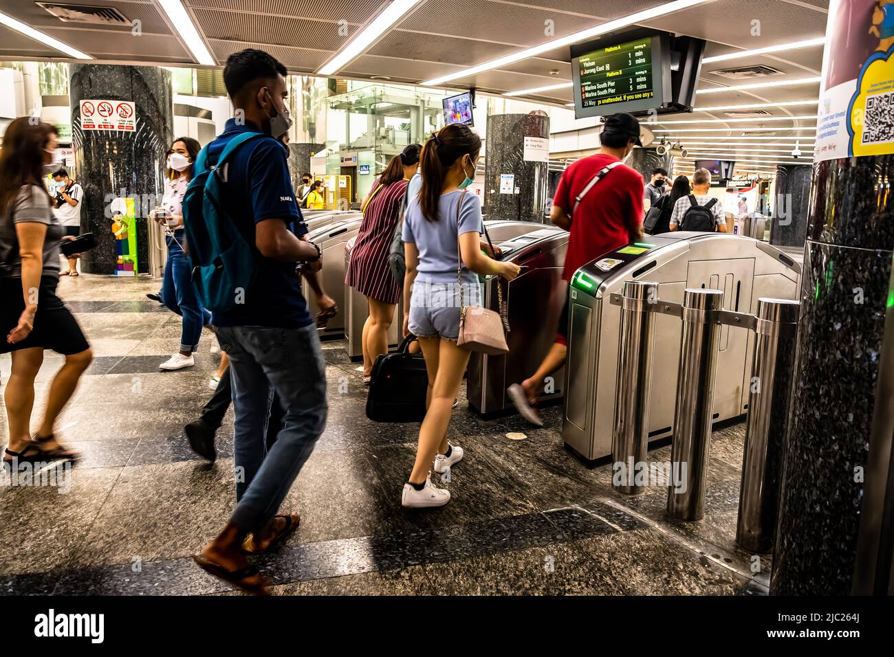Passengers checking in at Automatic Fare Collection Gates at Orchard ...