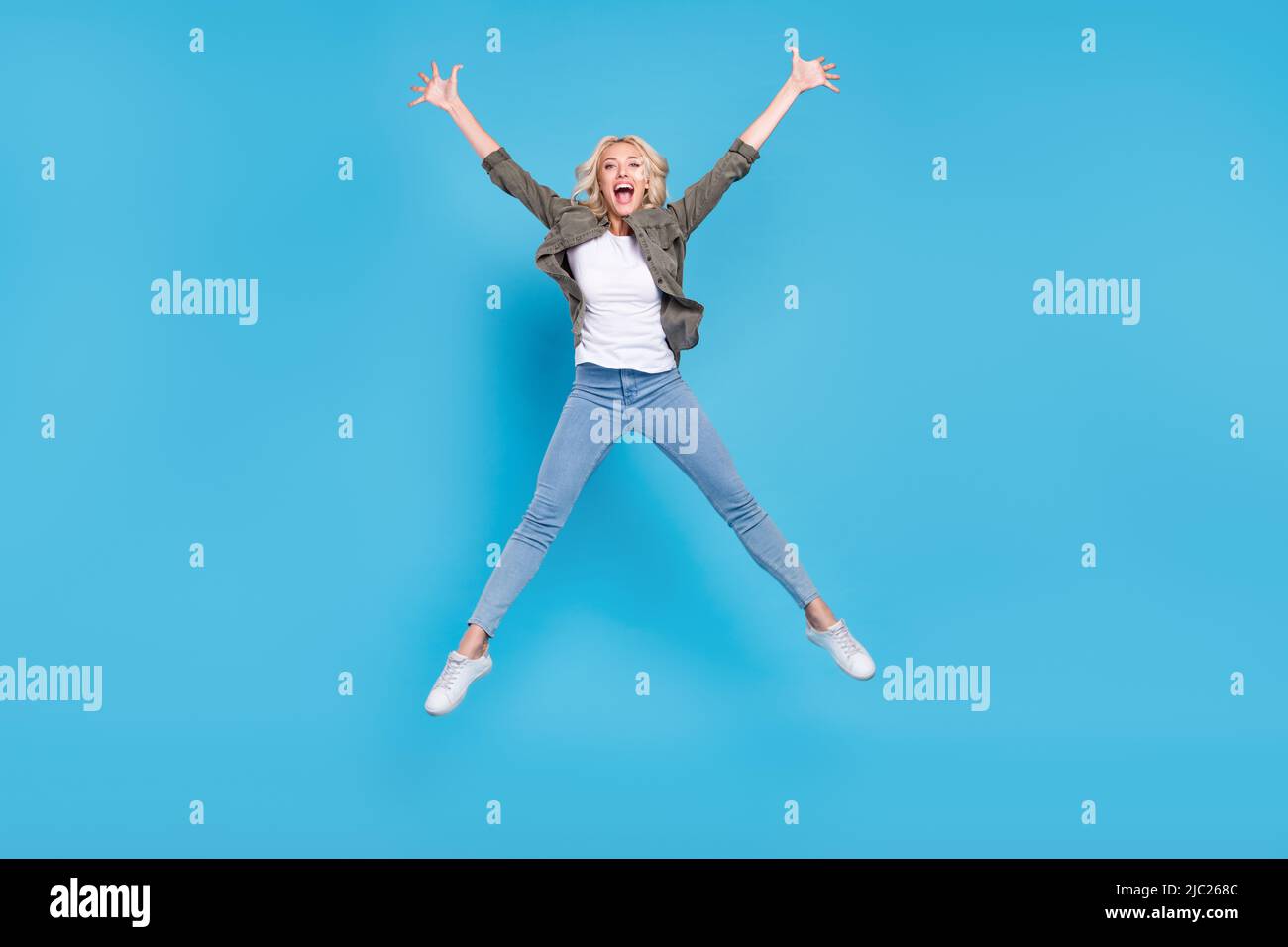 Full length body size photo amazed woman jumping up careless happy ...