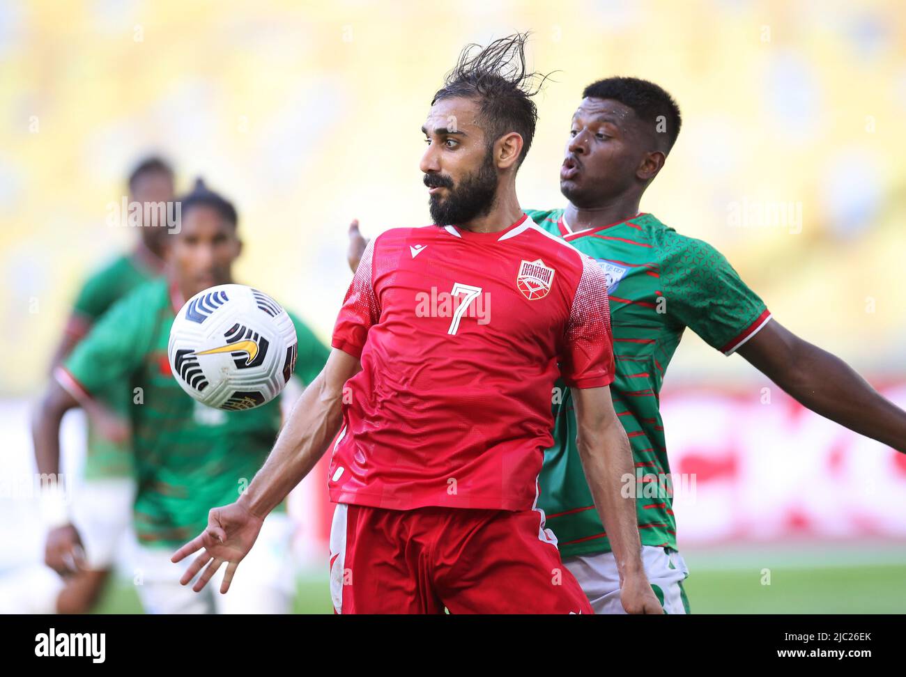 Ali Jaafar Madan (L) of Bahrain in action during the AFC Asian Cup 2023 ...
