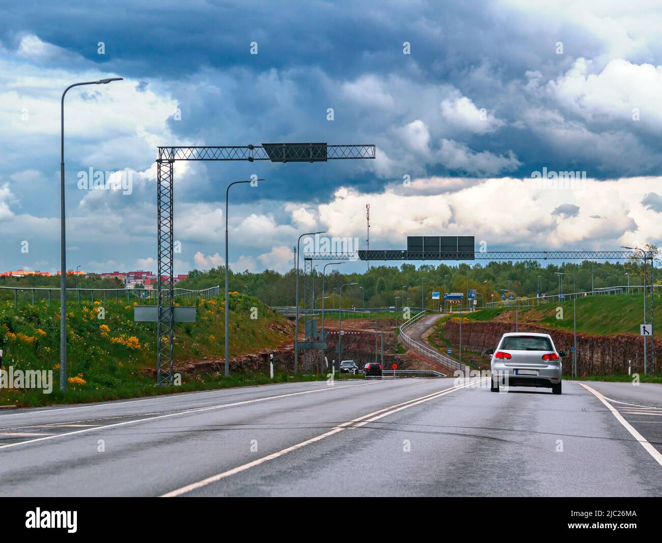 Car driving on empty road, Estonia, Europe Stock Photo - Alamy
