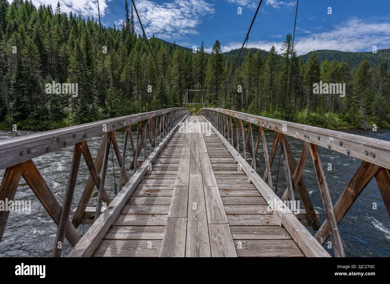 A foot bridge over the Lochsa River at the Split Creek Trailhead in the ...