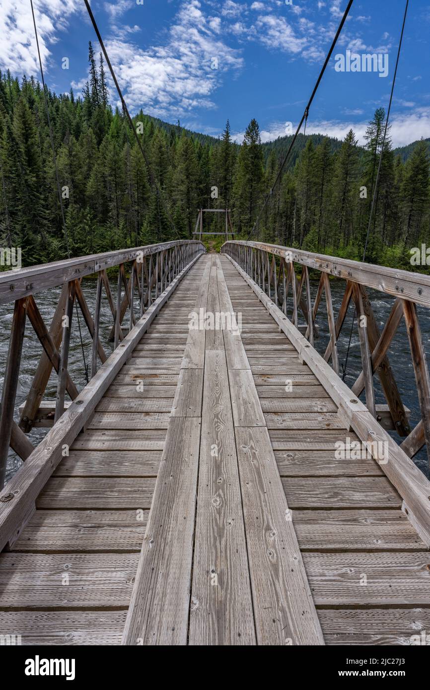 A foot bridge over the Lochsa River at the Split Creek Trailhead in the ...