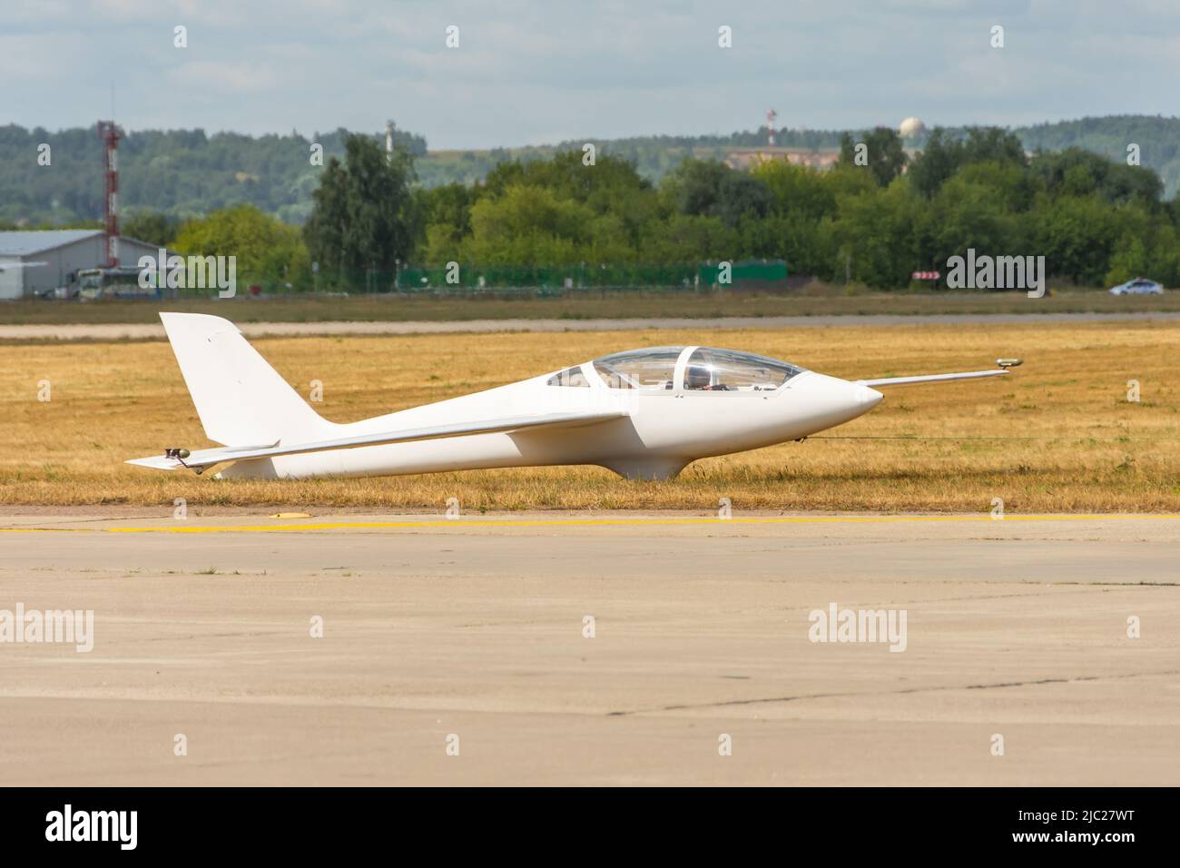 Ultralight glider plane stands on the grass, landing on earth aerodrome ...