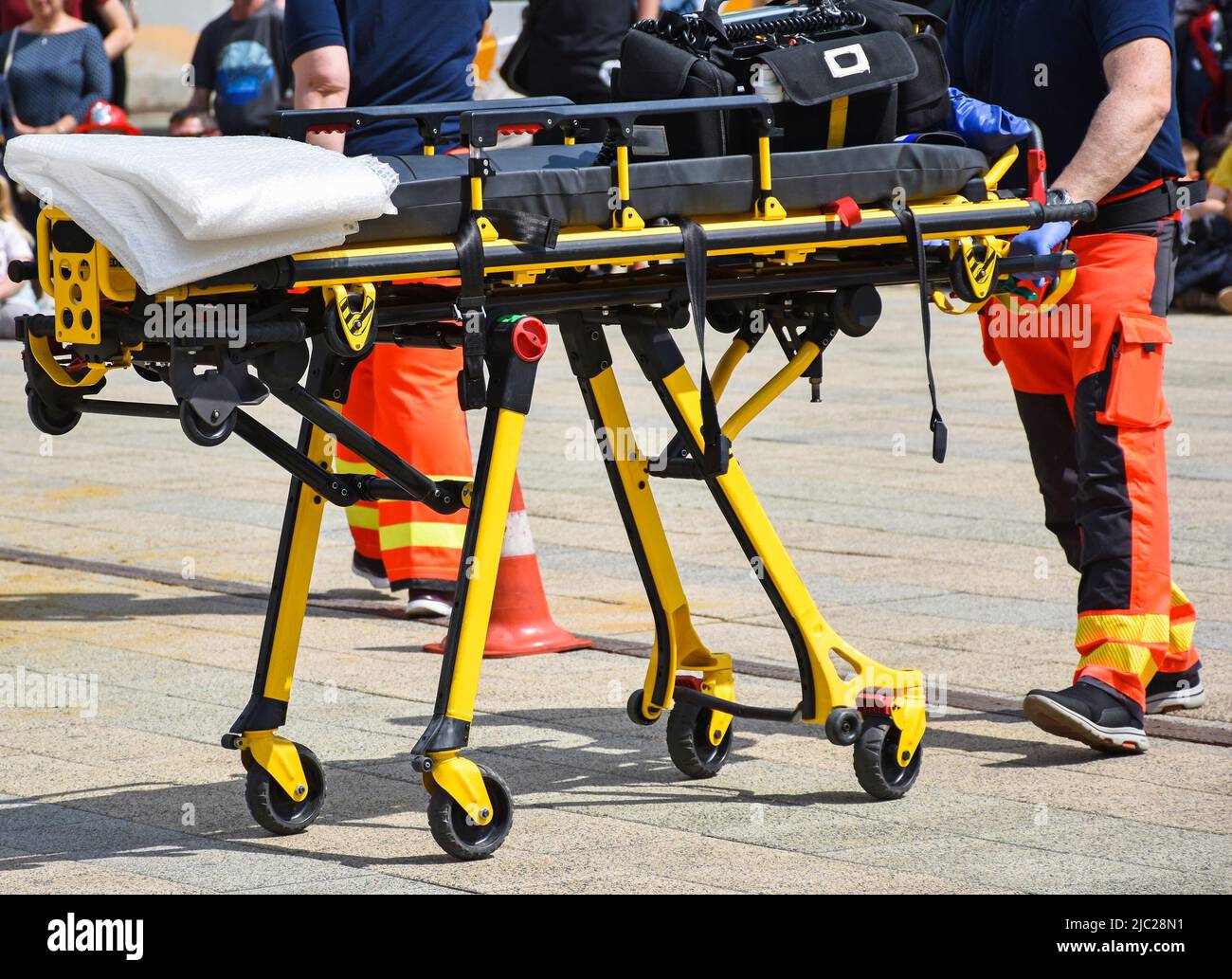 Paramedic with a stretcher on the street Stock Photo - Alamy