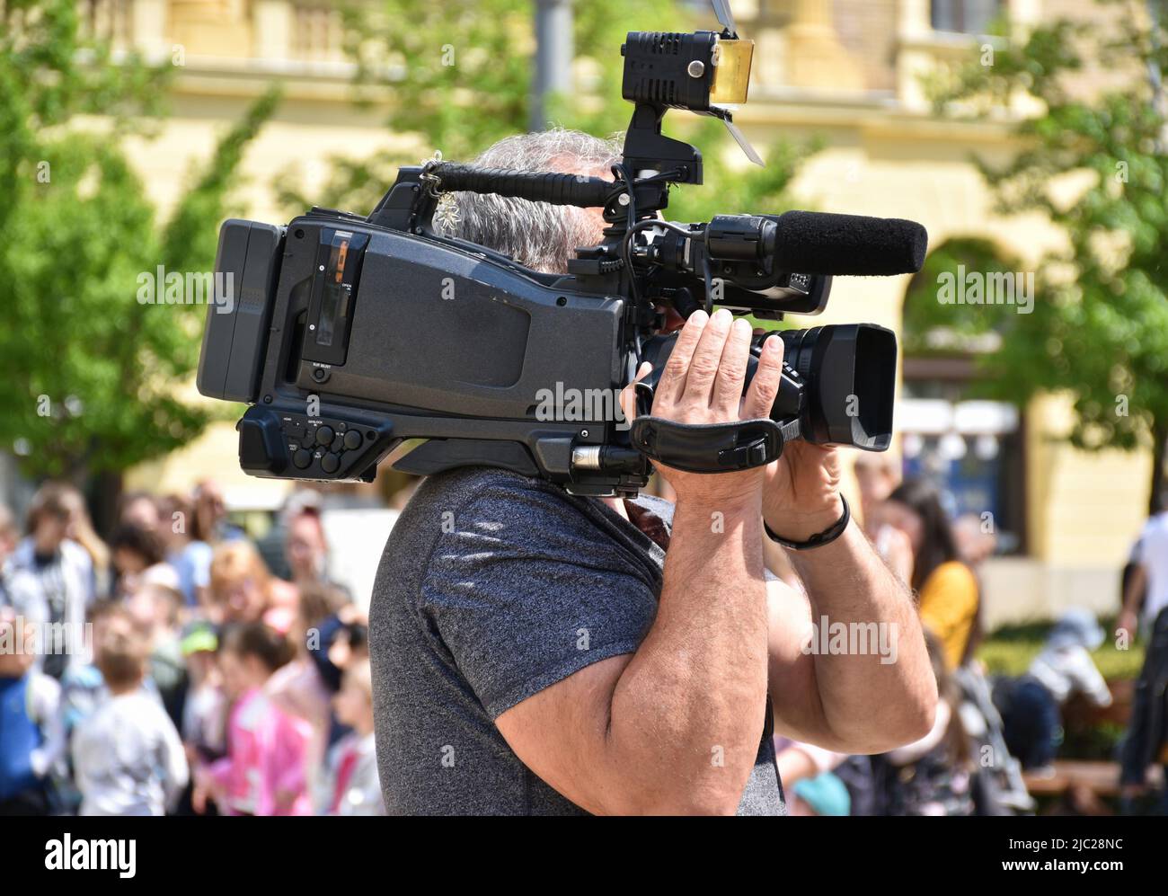 Cameraman at work outdoor on the street Stock Photo - Alamy