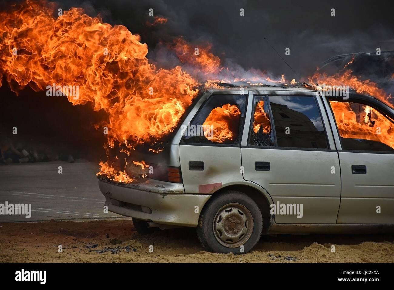 Burning and flaming car outdoor Stock Photo - Alamy