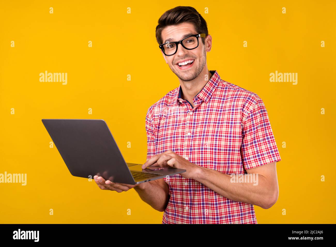 Photo of young man happy positive smile chat type project email ...