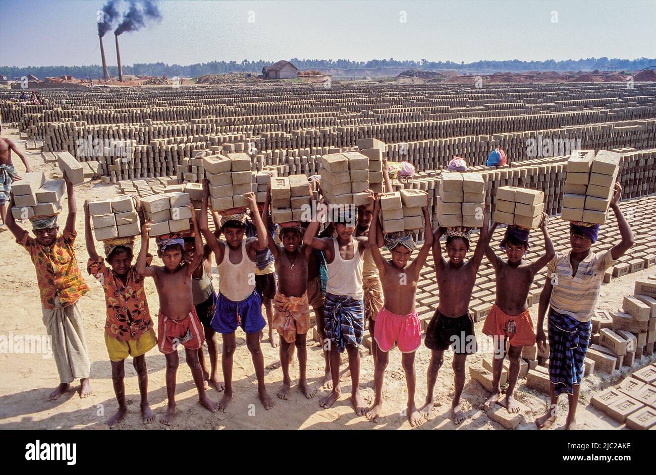 Bangladesh; child workers carrying bricks Stock Photo - Alamy