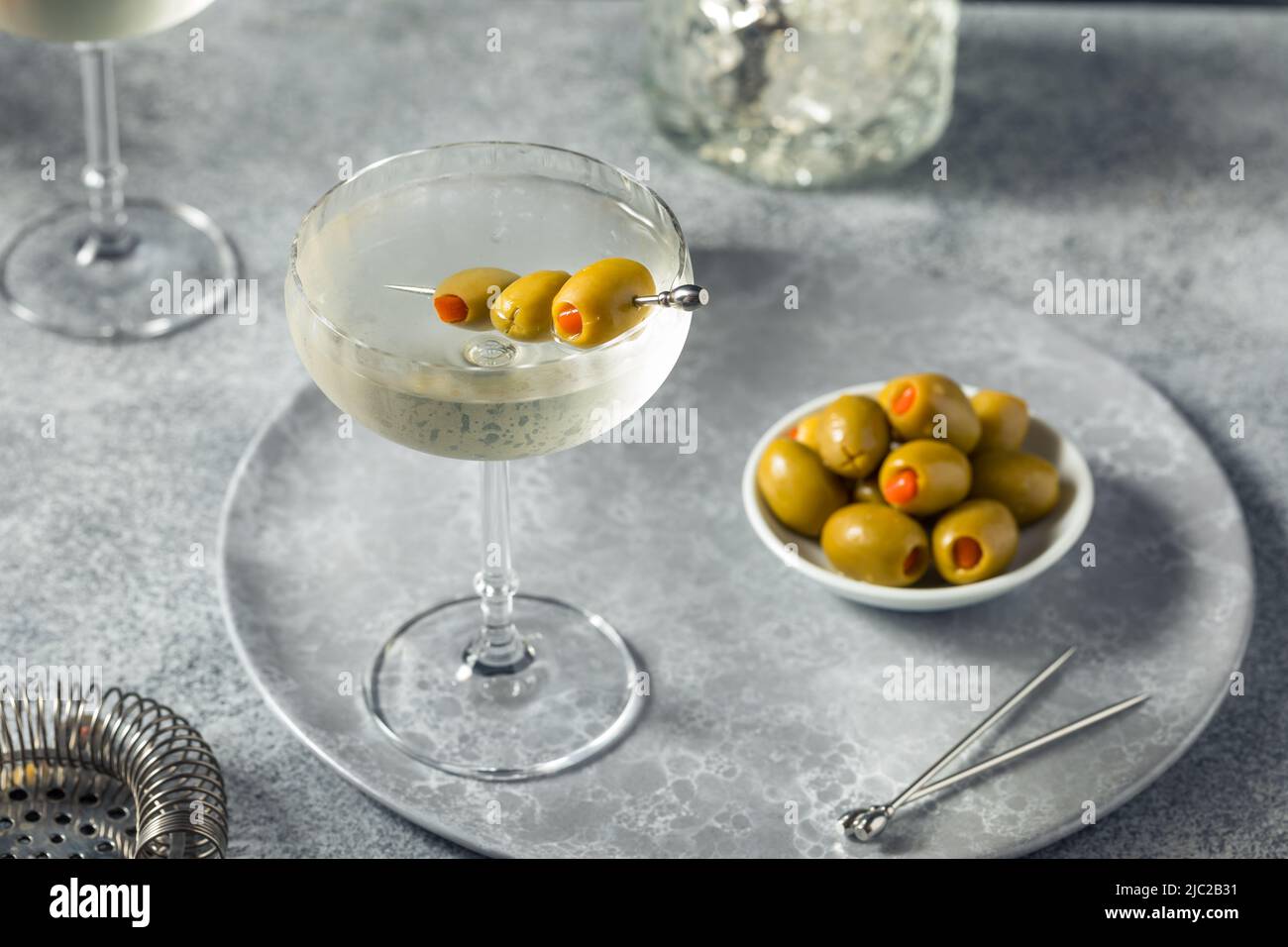 Boozy Refreshing Dry Gin Martini with Olive Garnish Stock Photo - Alamy