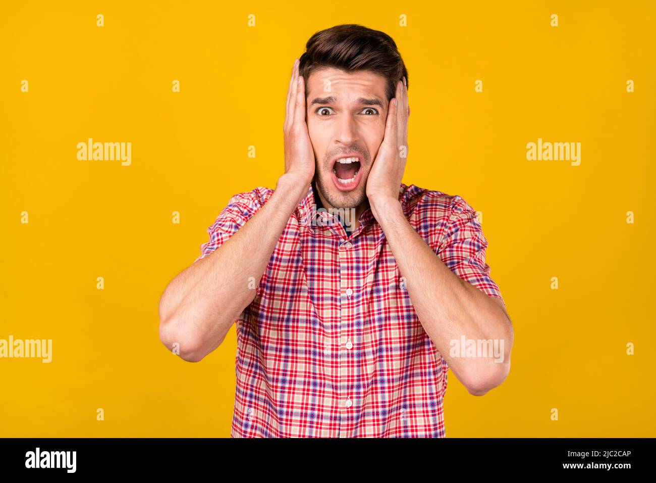 Portrait of attractive amazed worried overwhelmed guy sudden news ...