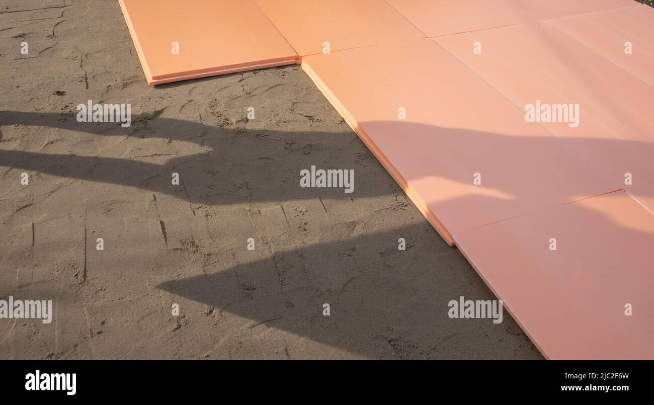 The polyplex polystyrene slab is laid on wet sand as insulation for the ...