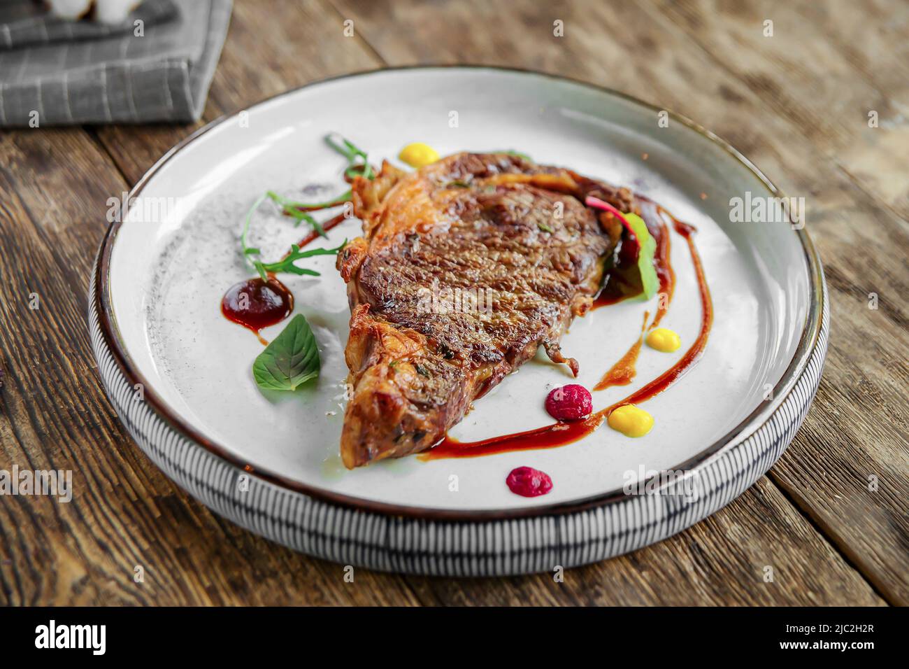 Portion of gourmet grilled beef steak Stock Photo - Alamy