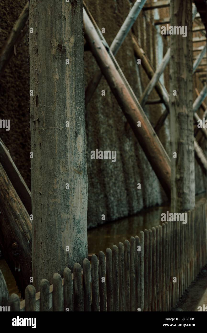 An old dark building with a narrow passage in a salt production ...