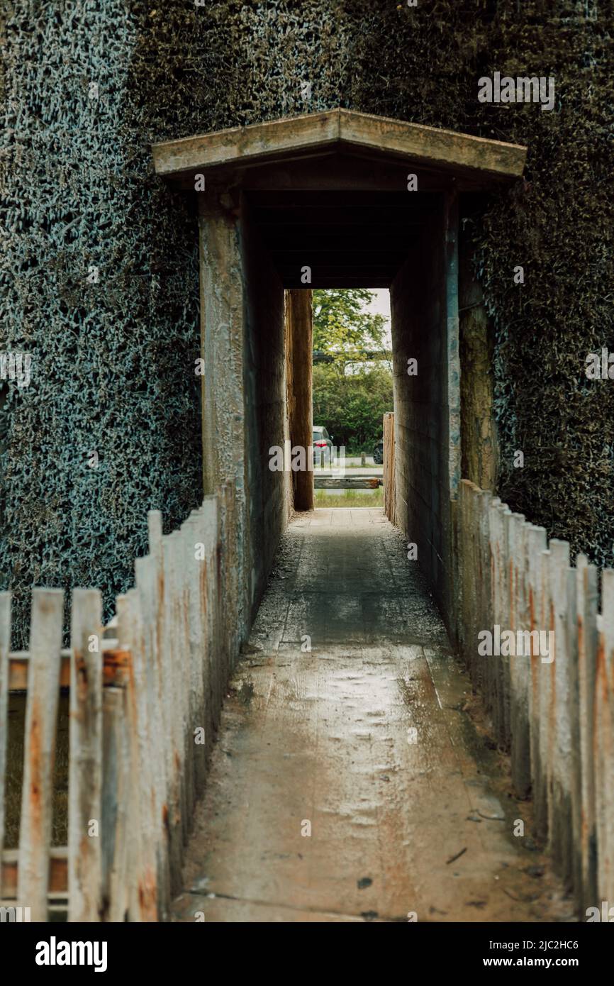 An old dark building with a narrow passage in a salt production ...