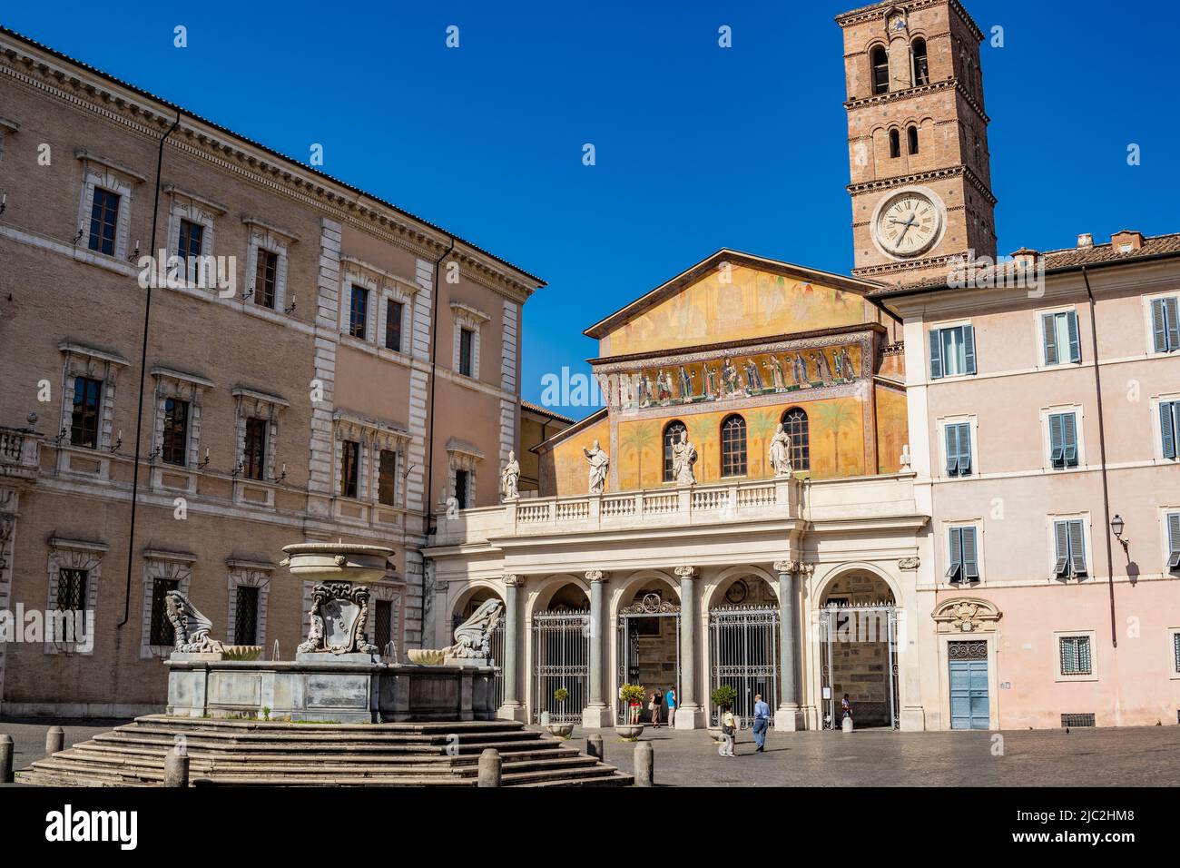The basilica of Santa Maria in Trastevere, in a square of the center of ...