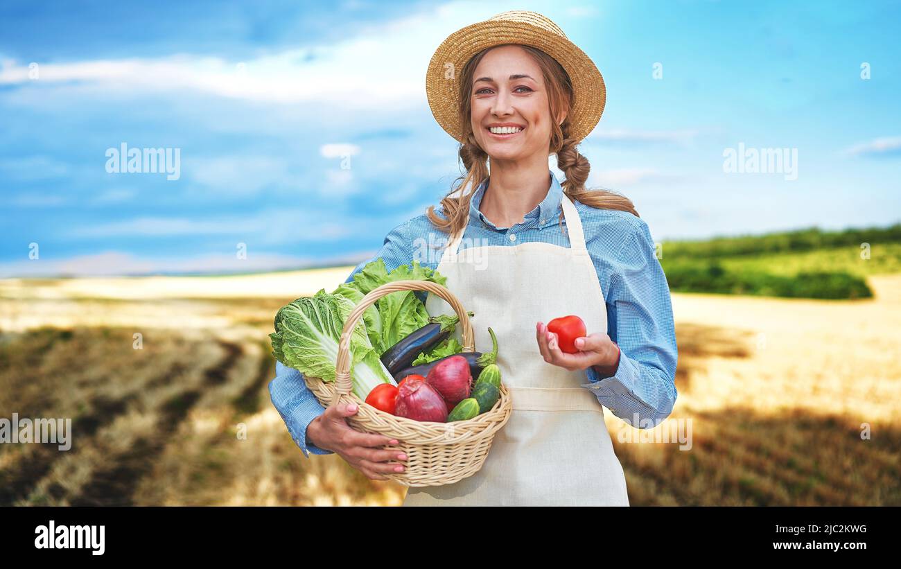 Woman farmer straw hat holding basket vegetable onion tomato salad ...
