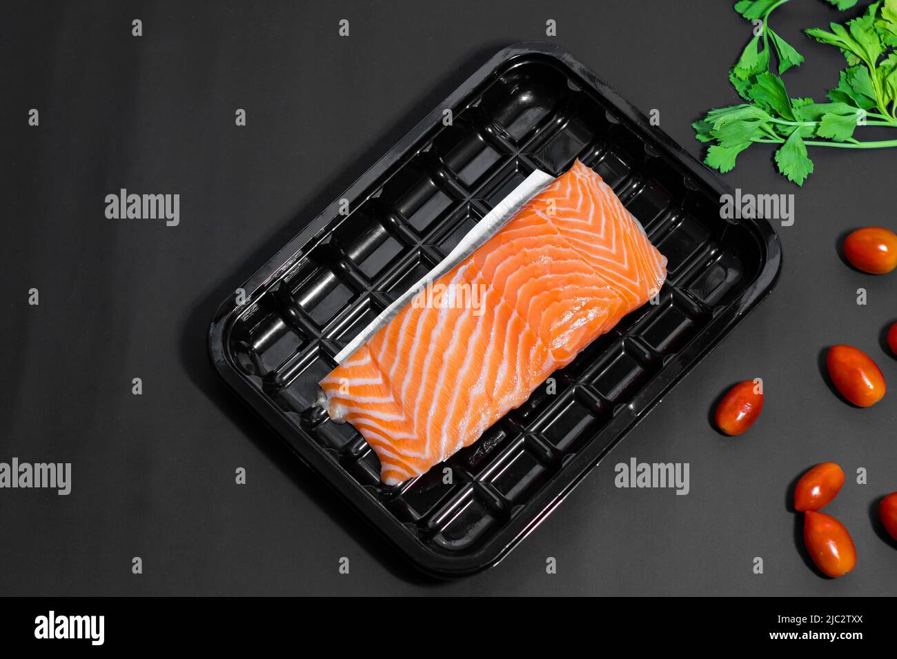 Salmon run stock on plastic packaging with food absorbent in ...