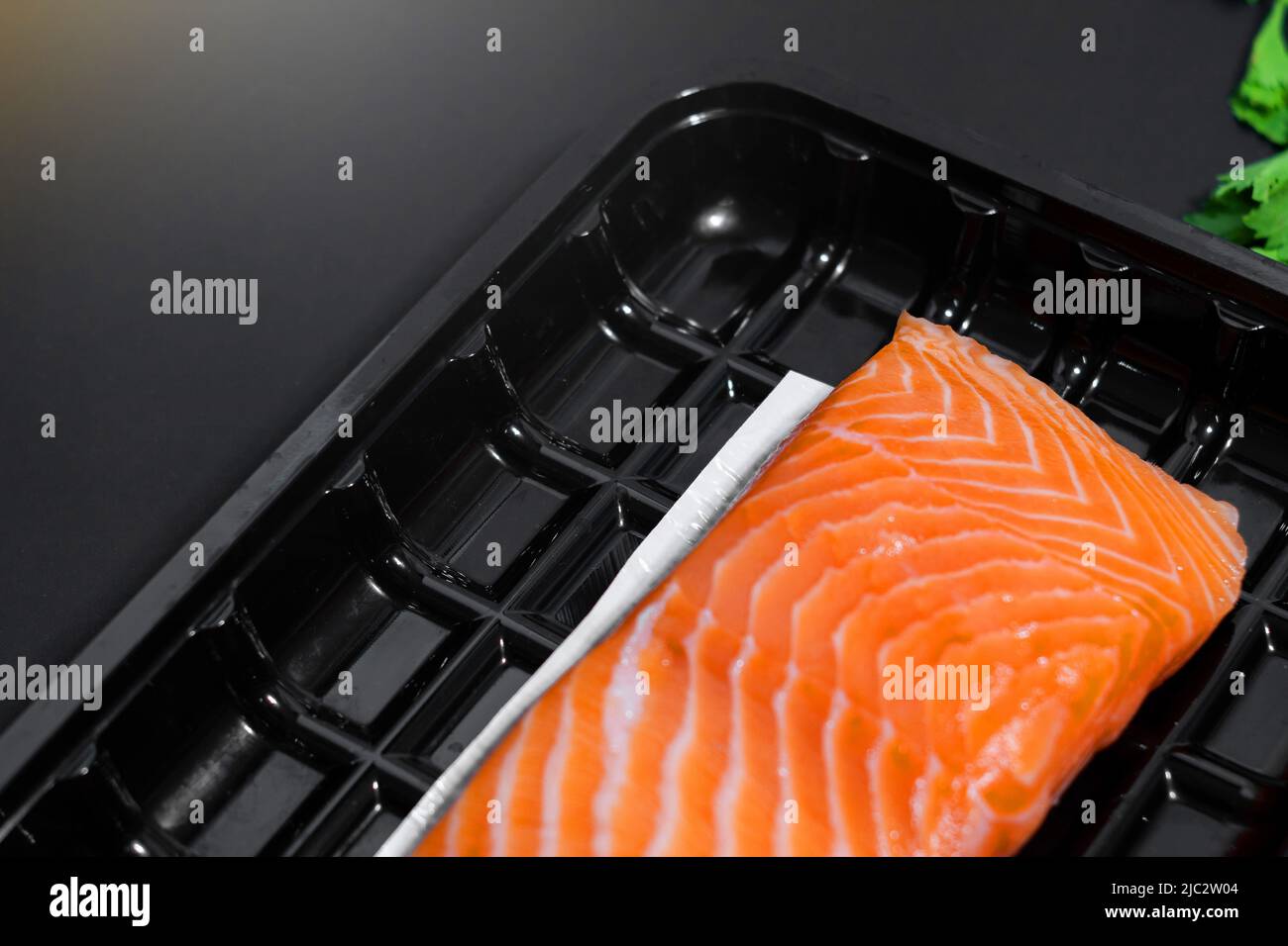 Salmon run stock on plastic packaging with food absorbent in ...