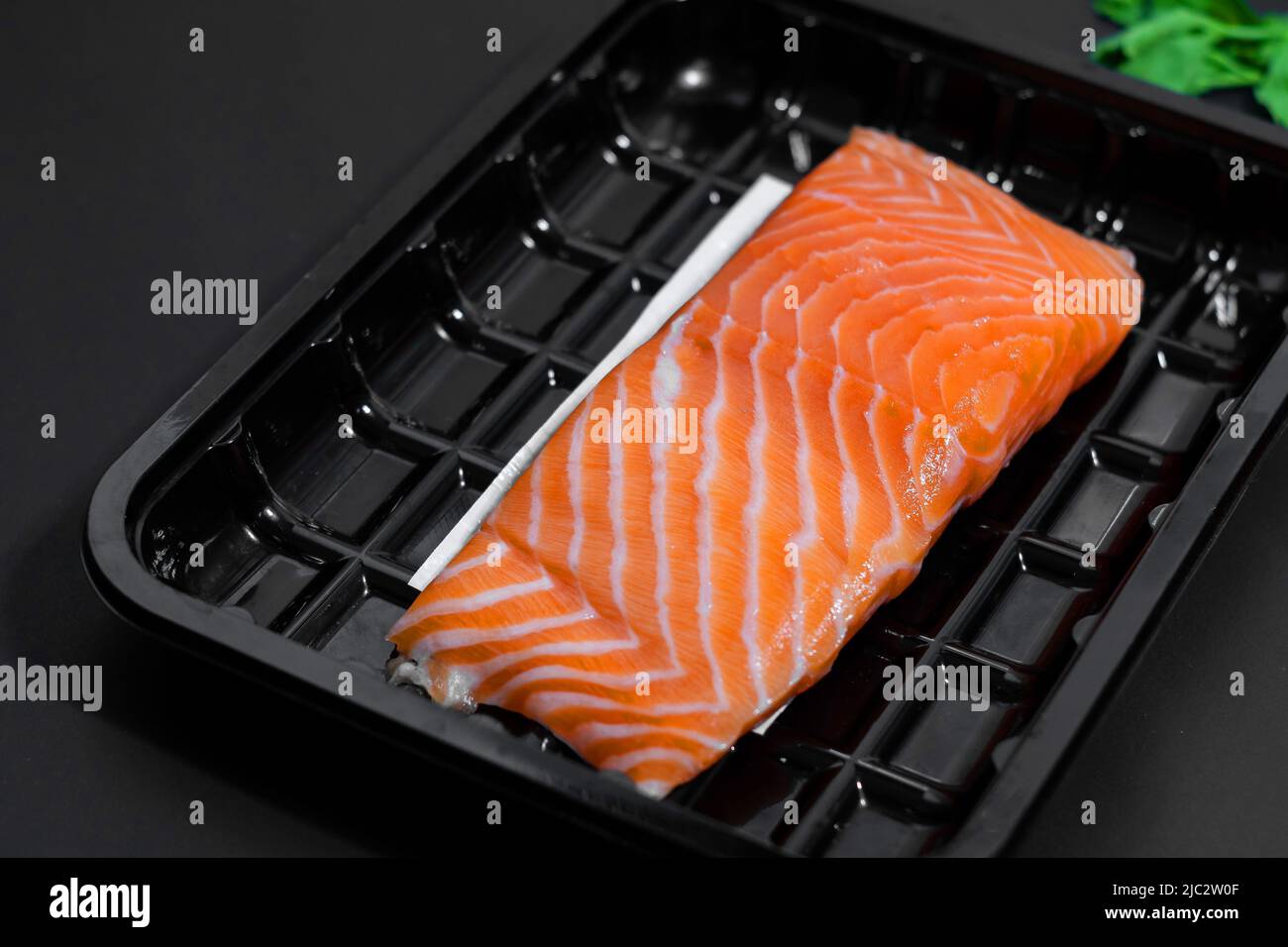 Salmon run stock on plastic packaging with food absorbent in ...