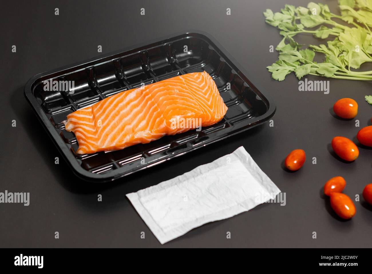 Salmon run stock on plastic packaging with food absorbent in ...