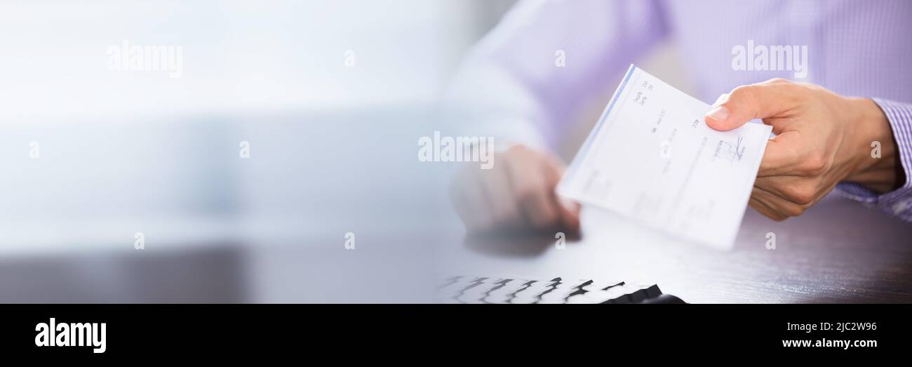 Paying in cheque hi-res stock photography and images - Alamy