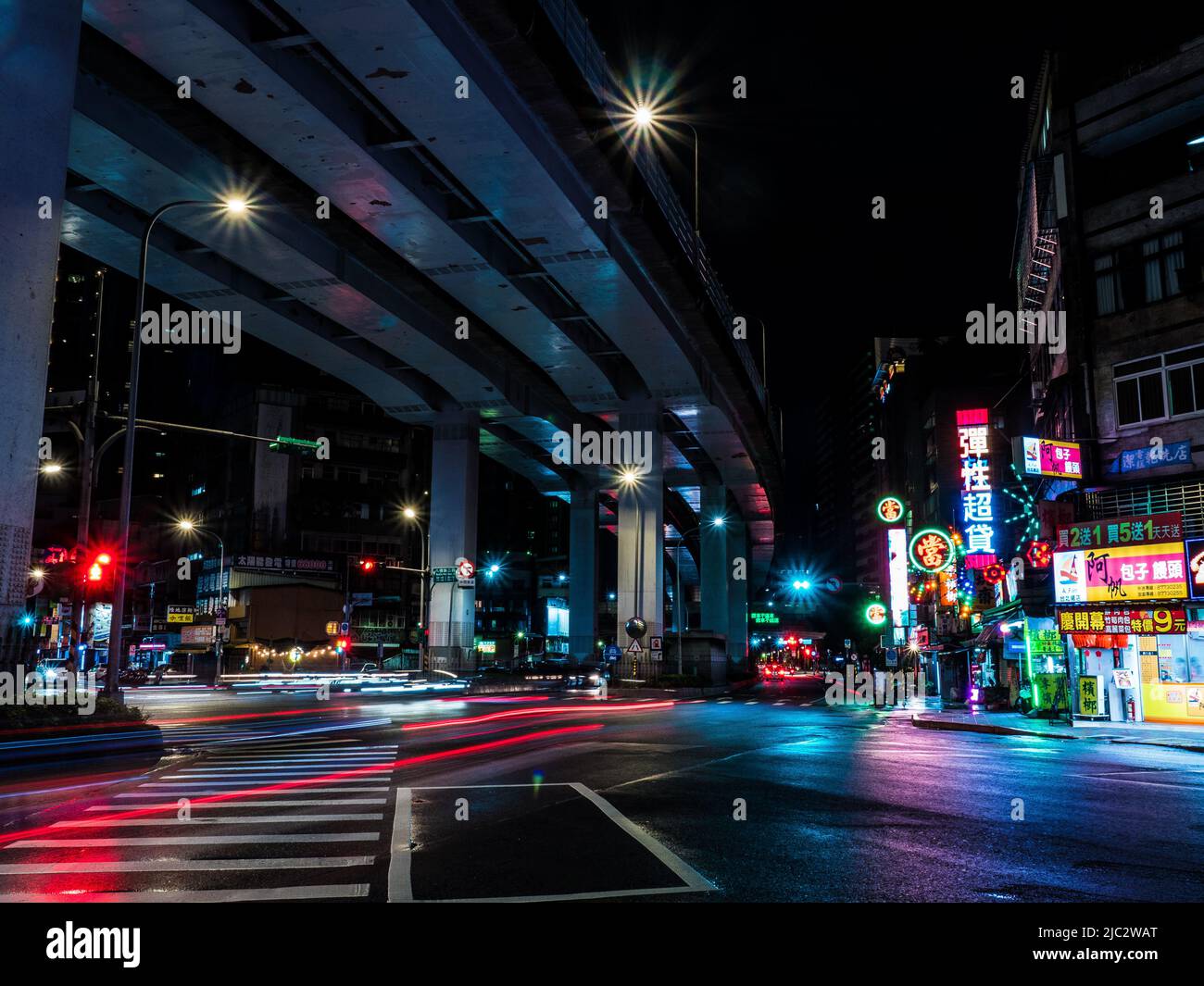 Long exposure shot of overpass with shops and neon lights, Taipei City ...
