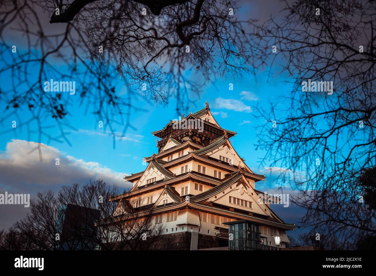 View to the Sunset Japanese Osaka Castle under Blue Sky and Trees Stock ...