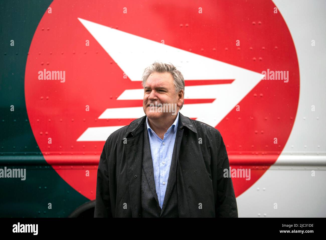 Canada Post CEO Doug Ettinger poses in front of an electric delivery ...