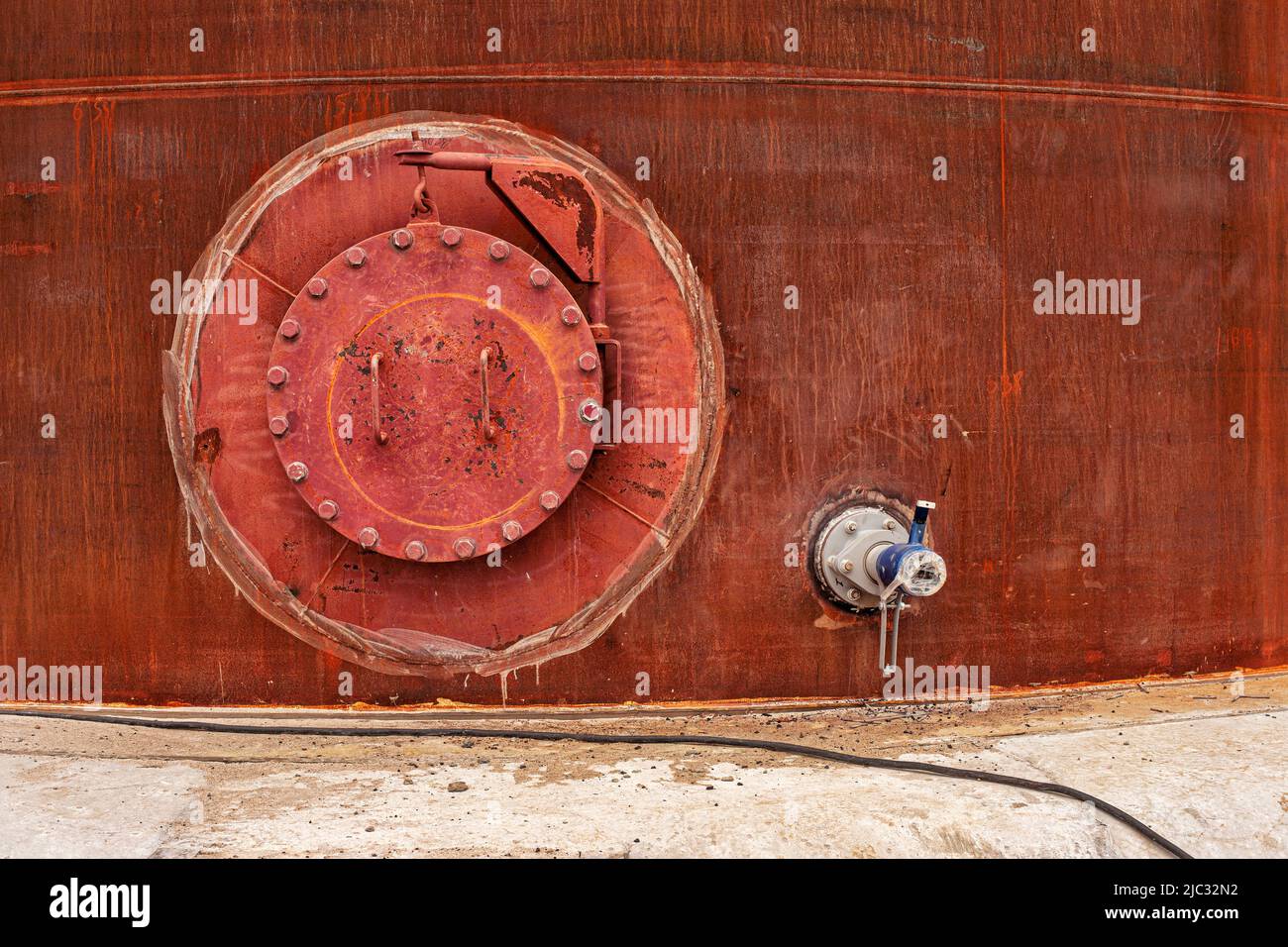 Opened rusty manhole on the fuel tank shell storage tank Stock Photo ...