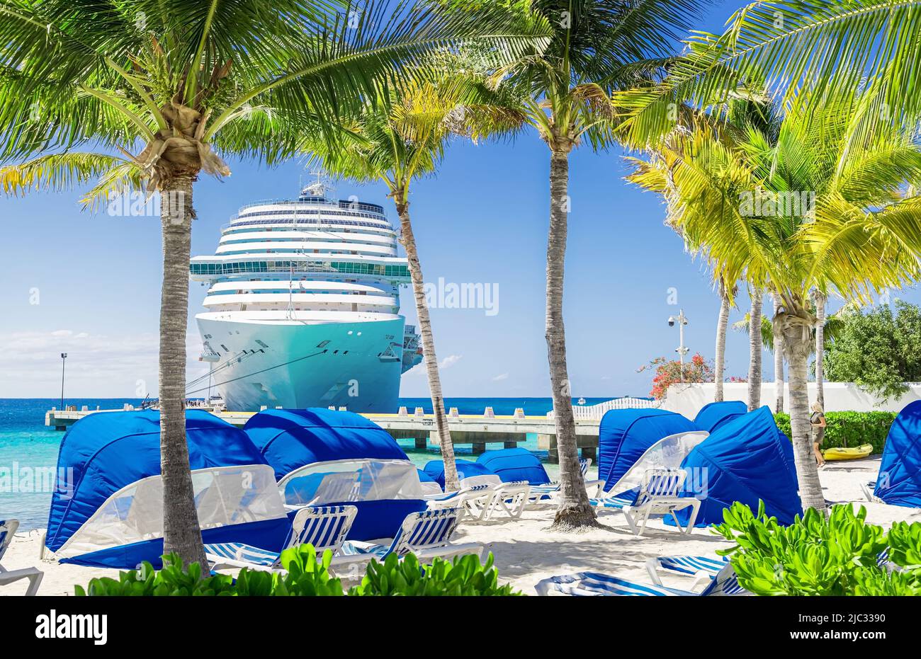 Cruise ship docked at tropical port on sunny day Stock Photo - Alamy