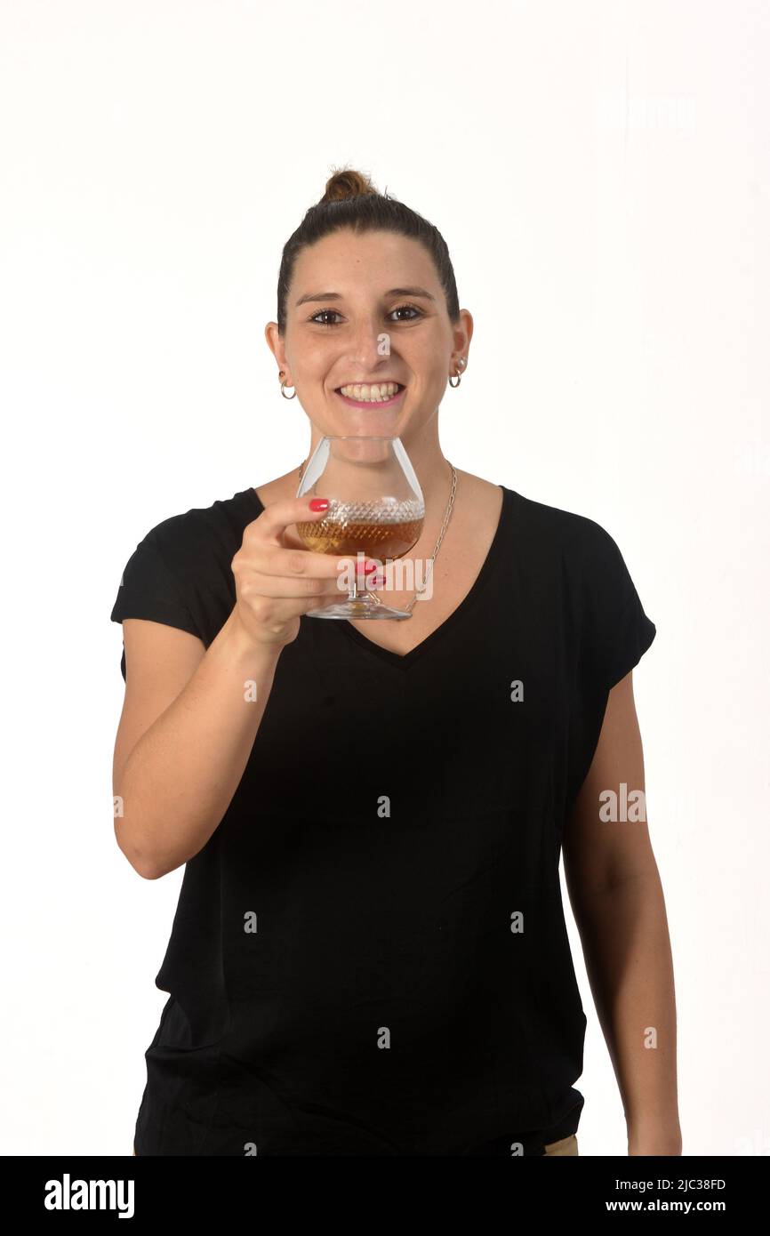 woman holdign a cup of alcohol on white background Stock Photo - Alamy