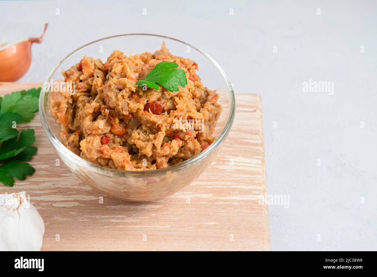 Glass bowl with Balkan baked eggplant based dish Kiopoolu on wooden ...