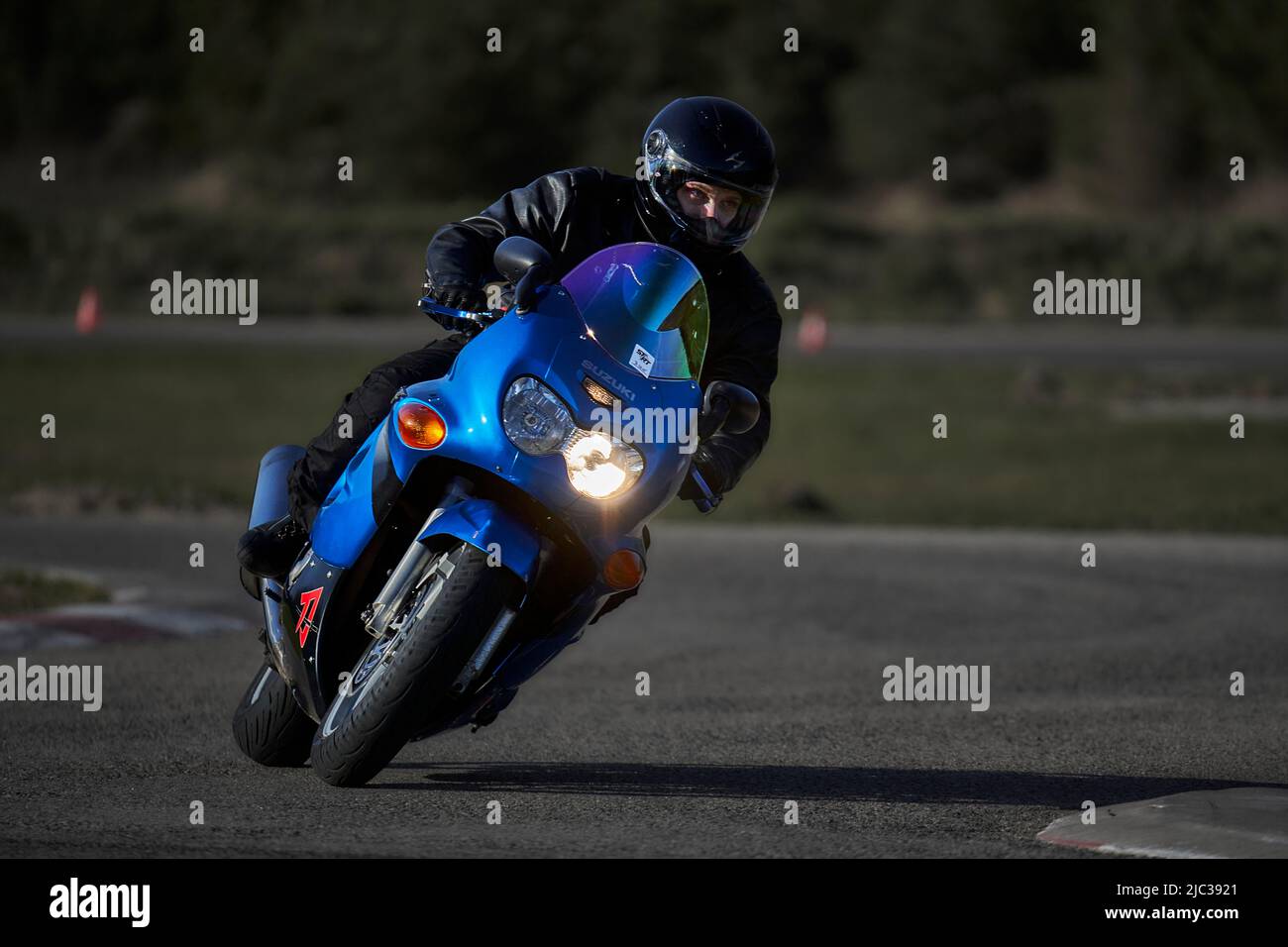 12-09-2022 Riga, Latvia man riding motorcycle in asphalt road ...