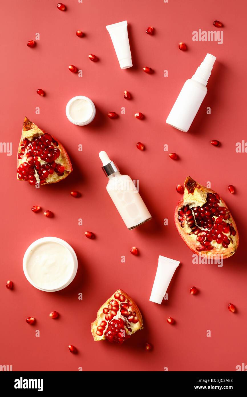 Set of natural fruit cosmetics with vitamin c on red background ...