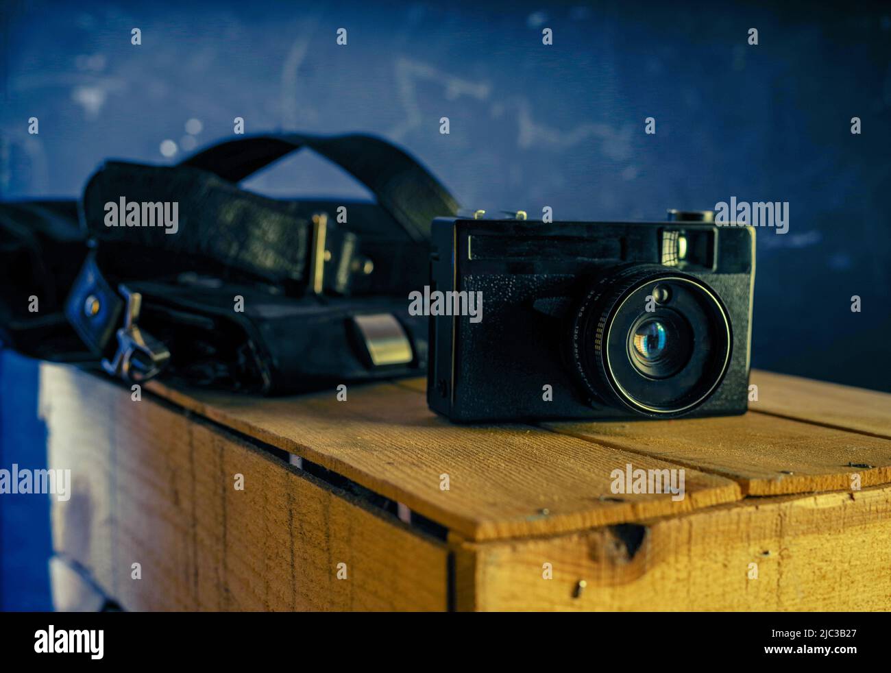 Film camera and beautiful lens flare. Vintage photo with an old camera ...